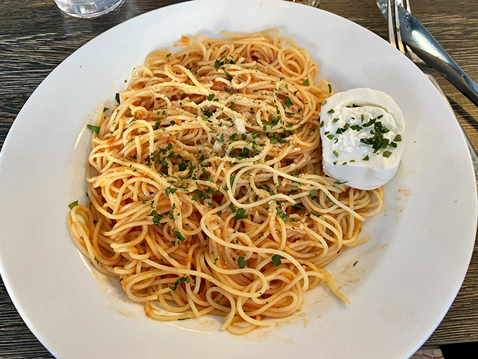 Sometimes the simplest dishes tell you the most about a restaurant – this perfect spaghetti with burrata is Italian cooking distilled to its essence.