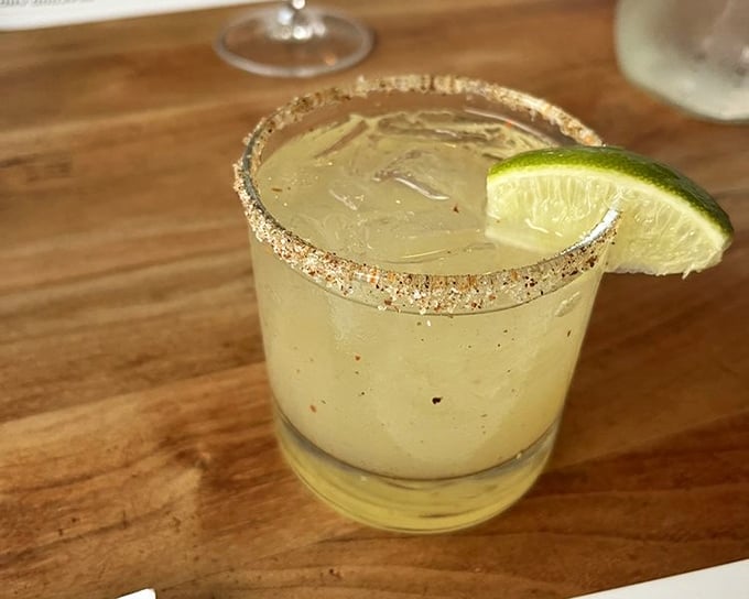 This isn't just a margarita—it's summer in a salt-rimmed glass, with lime standing by to ensure your taste buds never get bored.