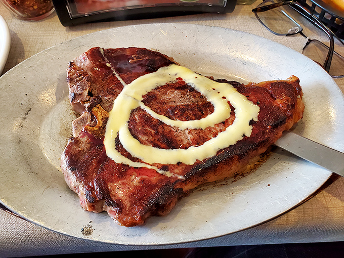 This isn't just a steak – it's a statement, complete with a mashed potato swirl that says "we care about presentation as much as flavor."
