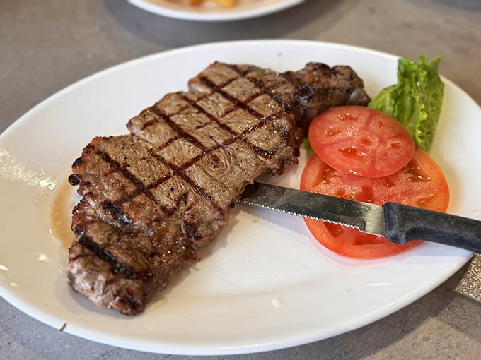 A perfectly grilled steak that needs no introduction—just a sharp knife, a hungry diner, and perhaps a moment of respectful silence before diving in.