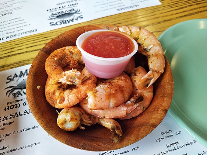 Plump steamed shrimp in a wooden bowl with cocktail sauce—simple, unpretentious, and exactly what seafood should be.
