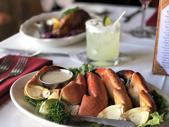 Stone crab claws arrive like nature's perfect appetizer – sweet, tender meat that requires only a squeeze of lemon and a moment of gratitude.