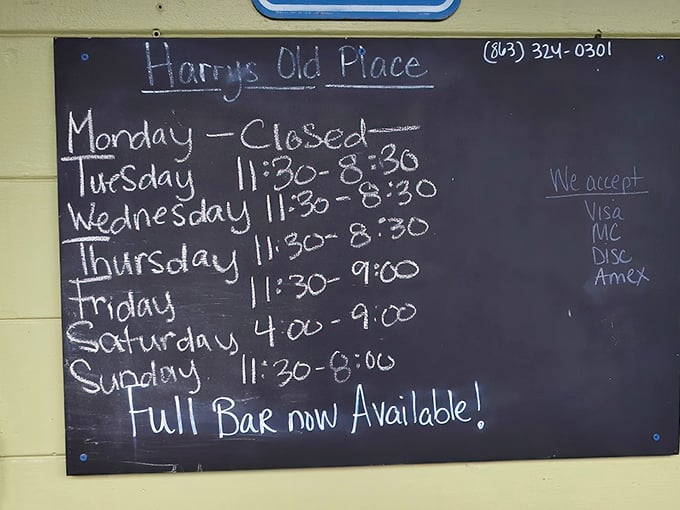 The handwritten hours board—a charming reminder that the best places march to their own schedule, not corporate mandates. 