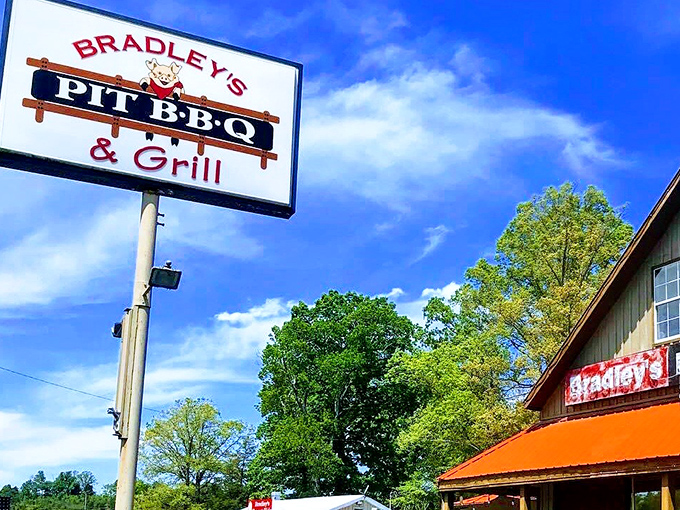 The sign against the blue Tennessee sky makes a bold promise that the kitchen more than keeps. Follow it like a North Star to barbecue nirvana.