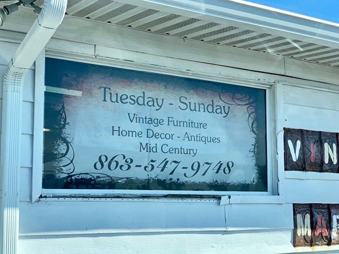 The store hours sign reveals the rhythm of treasure hunting—Tuesday through Sunday, when vintage dreams become tangible possibilities.