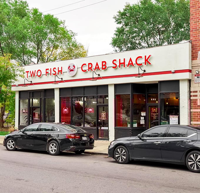 From the street, Two Fish Crab Shack's bright red signage calls to seafood lovers like a siren song—resistance is futile, and surrender is delicious.