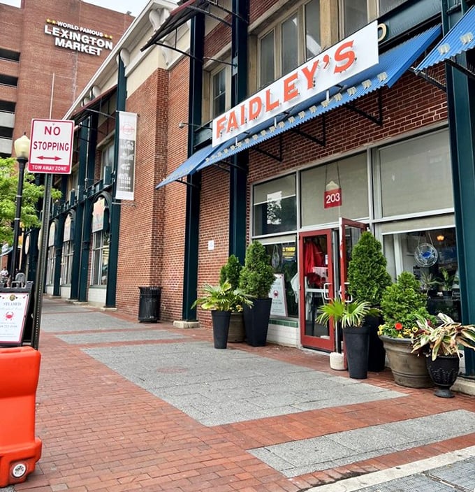The historic Lexington Market facade houses seafood greatness within. This isn't just a restaurant—it's a Baltimore institution.