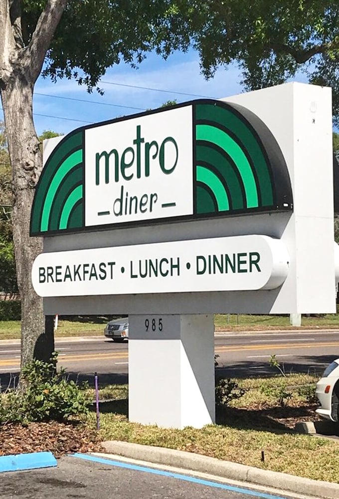 The sign that's guided hungry travelers like a lighthouse beacon of breakfast hope. Three meals a day, seven days a week—because food emergencies don't take holidays.