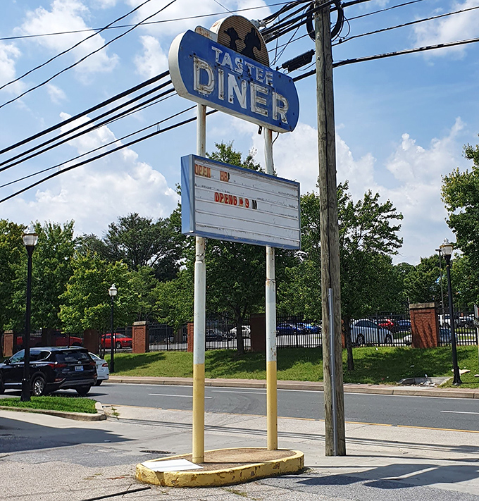 The weathered sign stands as a beacon to breakfast pilgrims—no fancy digital displays needed when you've been a landmark this long.