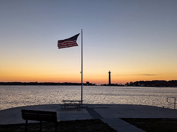 As day surrenders to dusk, Perry's Monument stands silhouetted against a watercolor sky—nature's perfect finale to an island adventure.