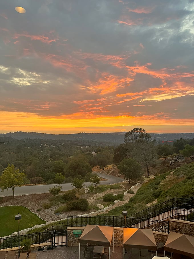 Mother Nature showing off her sunset skills over the Sierra foothills – the kind of view that makes dinner reservations fashionably late every single night.