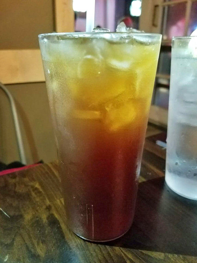 Sweet tea so perfectly layered it looks like a sunset in a glass—the unofficial wine pairing for serious barbecue enthusiasts.