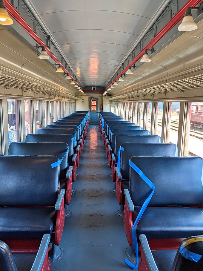 Empty seats waiting for their next storytellers—the pristine interior of the passenger car invites travelers to settle in for views no car window could ever match.
