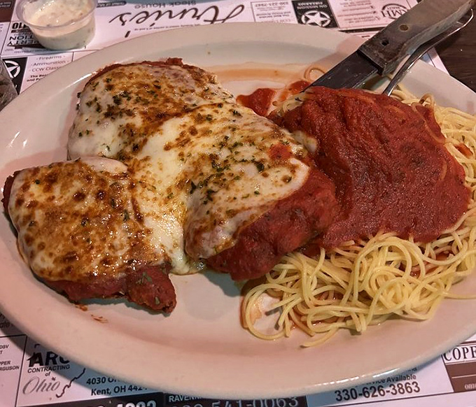 Veal Parmigiana that would make any Italian grandmother nod in approval—a perfect marriage of tender meat, tangy sauce, and melted cheese.