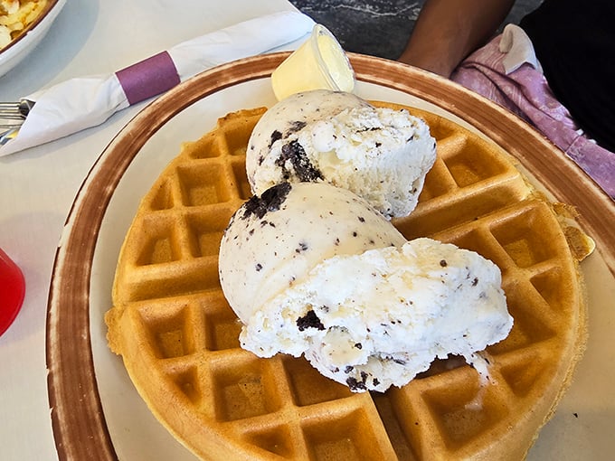 A golden waffle crowned with scoops of ice cream – proof that sometimes the best breakfast decisions aren't the most responsible ones.