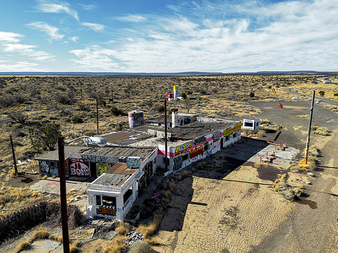 From above, the full scope of abandonment becomes clear—a once-bustling oasis of commerce now just another ghost along the Mother Road.