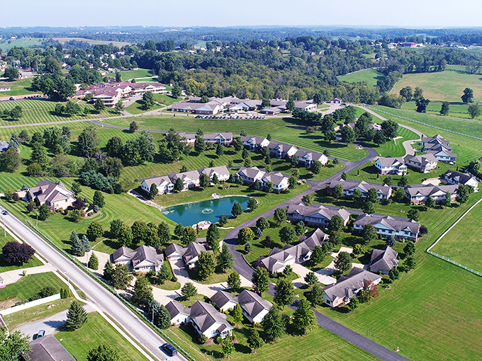 From above, even modern development reveals thoughtful planning – homes gathered around water like settlers around a campfire.