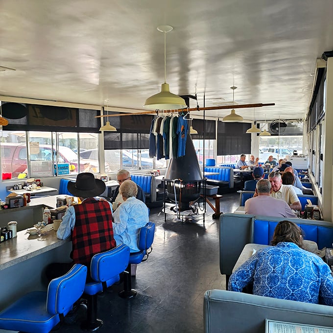 Blue booths filled with satisfied customers. The breakfast buzz creates a symphony of clinking forks and contented conversation.
