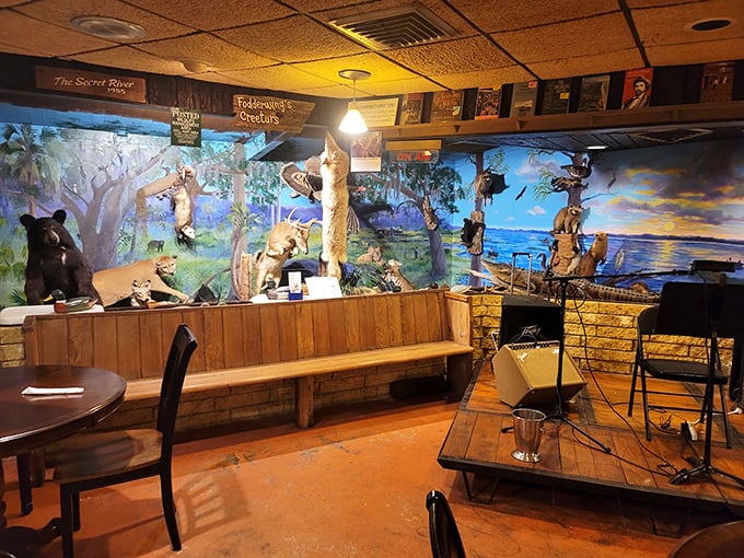The stage area features Florida wildlife displays and murals depicting natural landscapes – dining with a side of natural history education.