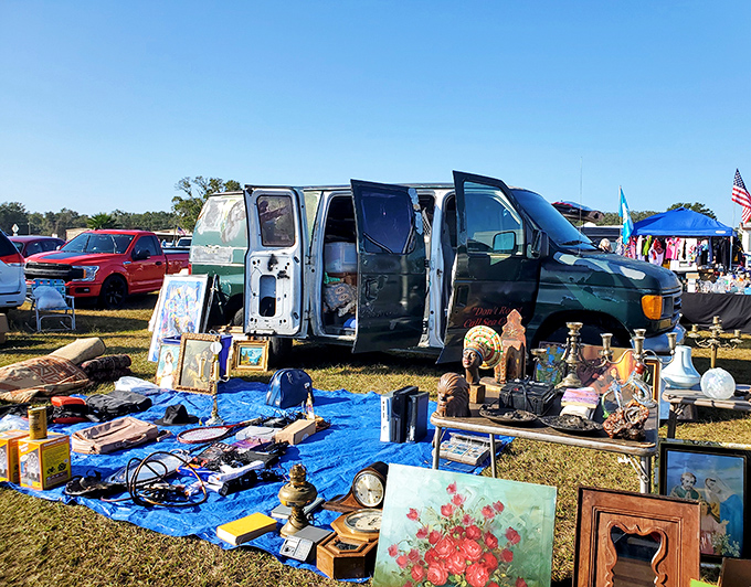 The ultimate pop-up shop experience: a van door opens to reveal carefully arranged treasures, proving that retail space is wherever you park it.