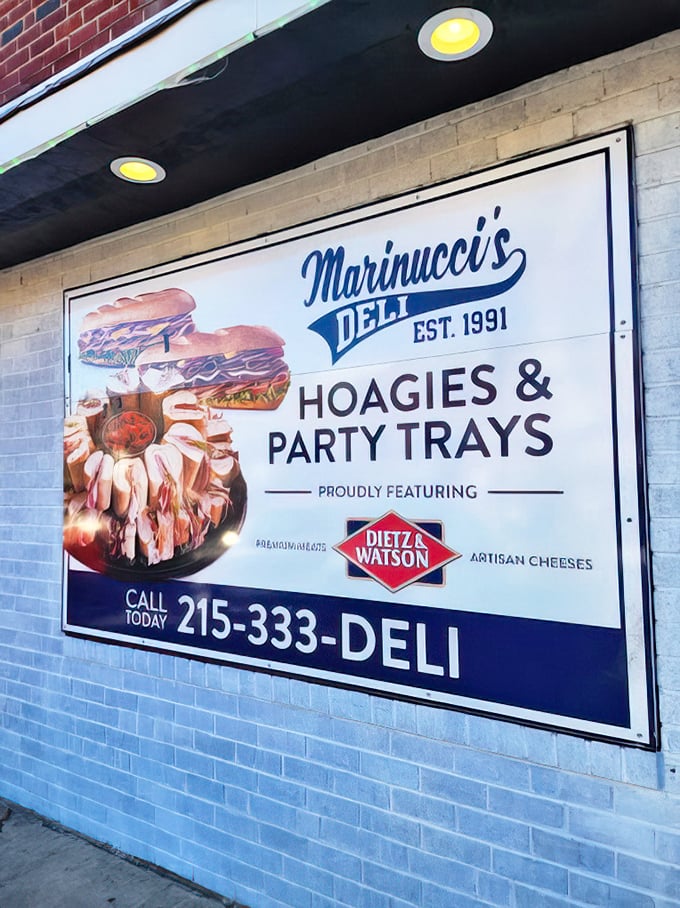 That sign promises hoagies and party trays – basically everything you need for happiness, professionally displayed.