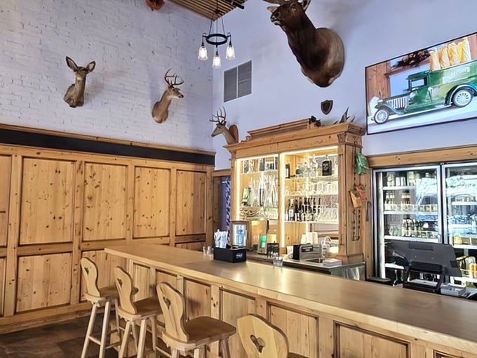 The bar area combines rustic German hunting lodge aesthetics with Florida hospitality—those mounted deer heads have seen some serious beer steins raised in celebration.