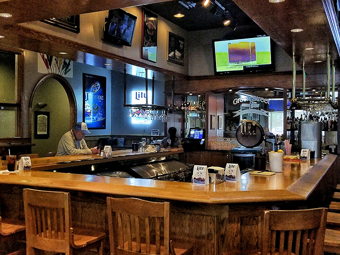 The bar area—where strangers become friends, sports are debated, and the bartenders remember your usual after just two visits.