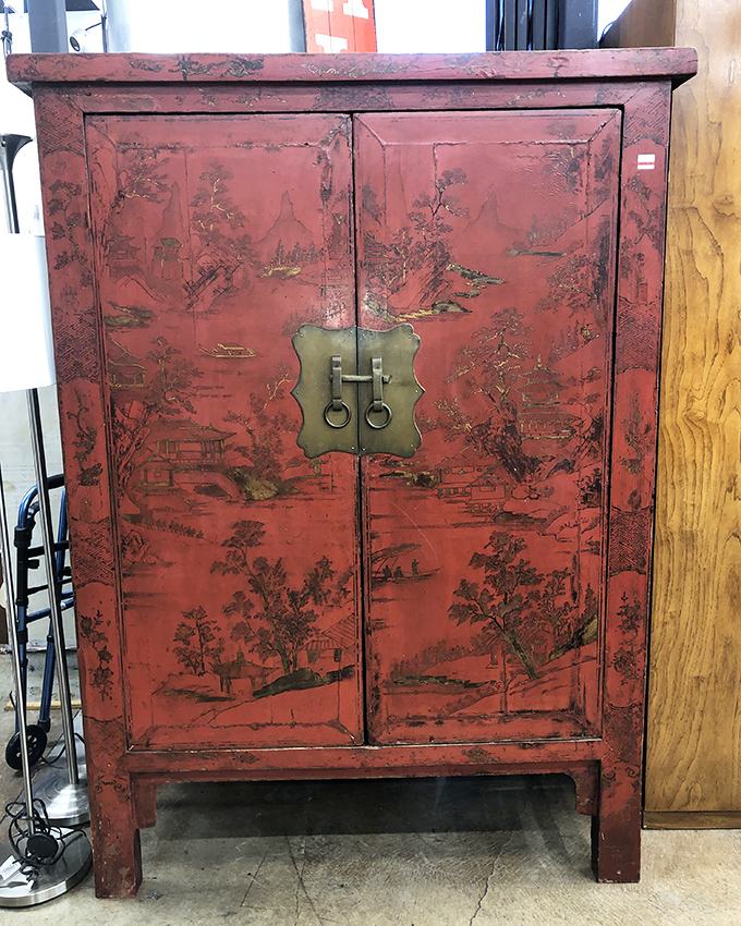 This red lacquered Chinese cabinet isn't just furniture—it's a conversation piece with more character than most dating app matches.