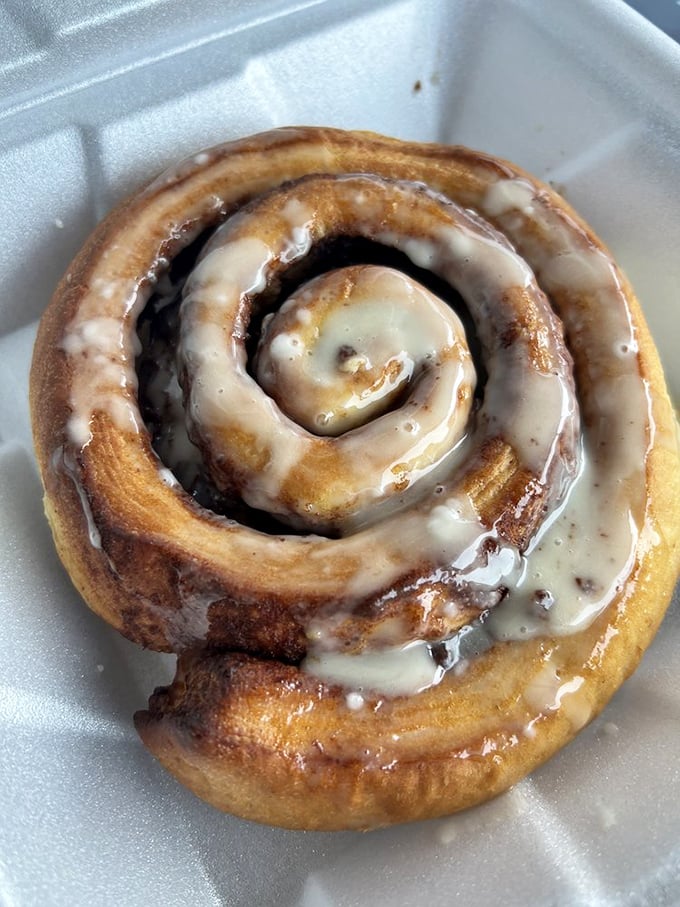 This cinnamon roll isn't just breakfast – it's dessert with morning privileges. That glaze has more shine than most people's futures.
