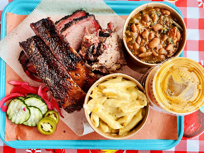 The BBQ combo platter—nature's perfect meal. Ribs, brisket, beans, and mac and cheese create a flavor quartet that performs in perfect harmony.