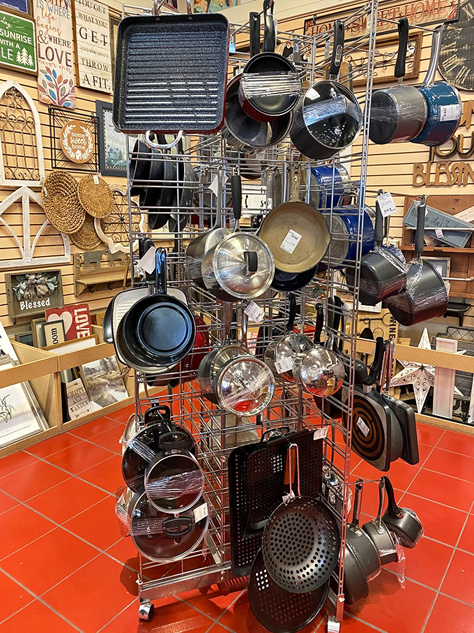 Cookware that's seen some delicious action hanging ready for new culinary adventures. That cast iron skillet has stories to tell!