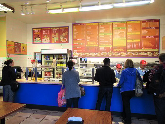 The ordering counter—where dreams are spoken aloud and transformed into foil-wrapped reality by the wizards behind the blue partition.
