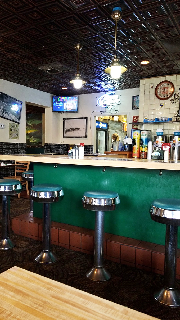 Classic diner counter seating – where solo diners become regulars, and the breakfast show unfolds before your eyes. The best seat in the house.