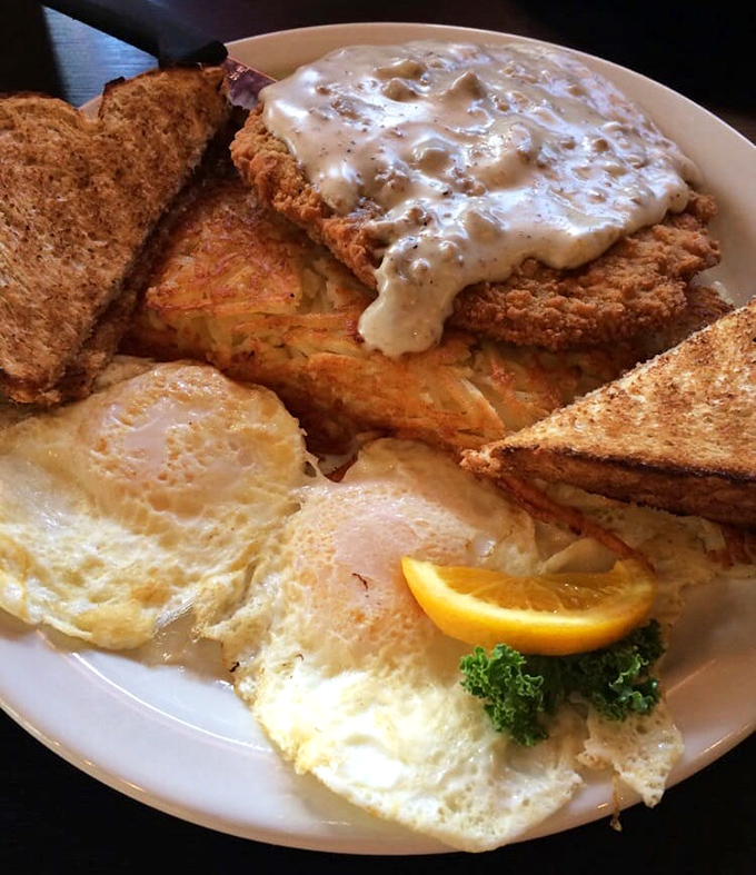 Country fried chicken smothered in gravy alongside sunny-side-up eggs. The breakfast of champions who plan on napping by noon.