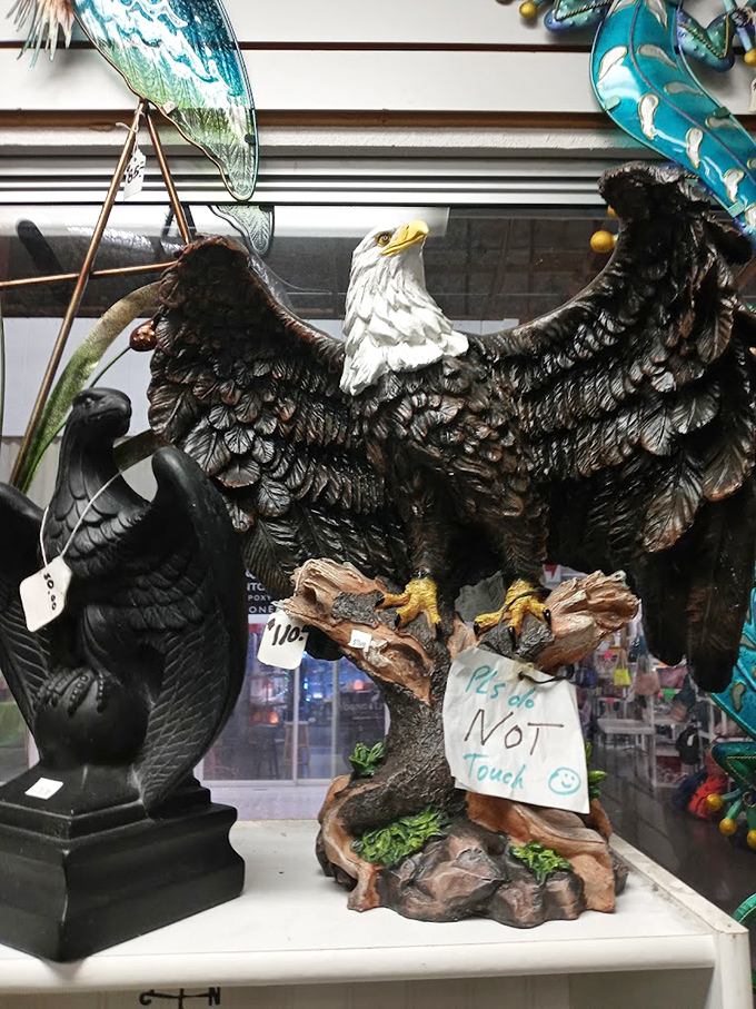 Nothing says "my home decor is complete" like a majestic eagle figurine with a polite "Please Do Not Touch" sign that somehow makes you want to touch it more.