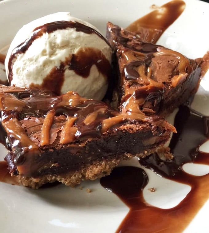 Chocolate, caramel, and ice cream—the holy trinity of dessert perfection. This isn't just a sweet ending; it's the reason elastic waistbands were invented.