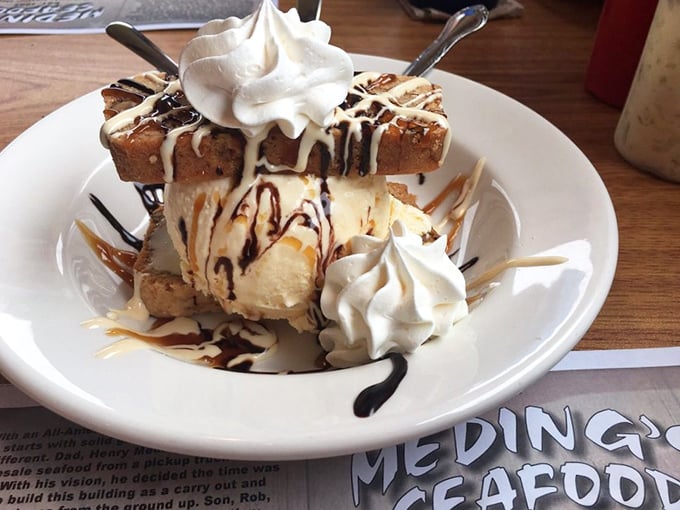 Dessert that throws moderation to the wind – because after conquering a seafood feast, you deserve this tower of sweet, creamy victory.