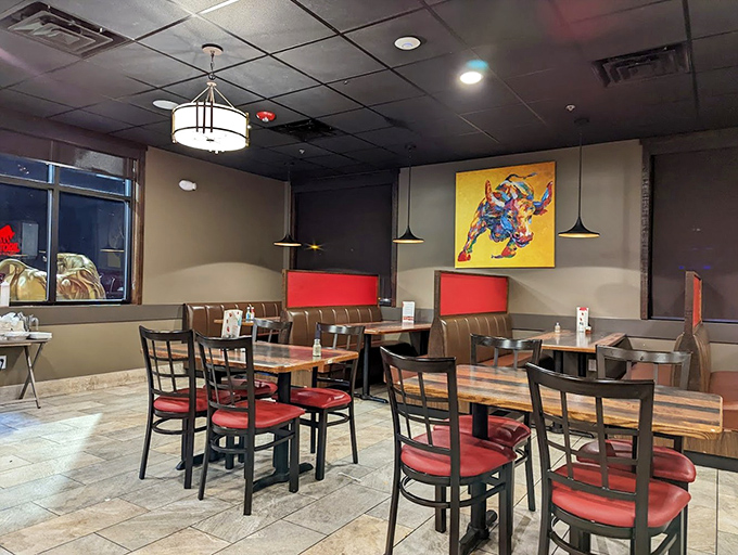The dining area balances simplicity with warmth. Those colorful bull paintings aren't just art; they're conversation starters for strangers about to become friends over shared meals.
