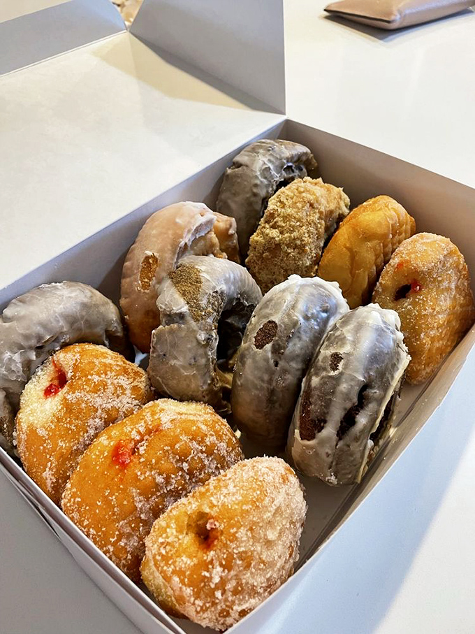 A box of donuts that makes the phrase "baker's dozen" sound like sweet music. Glazed, filled, and sugared—breakfast's greatest hits album.
