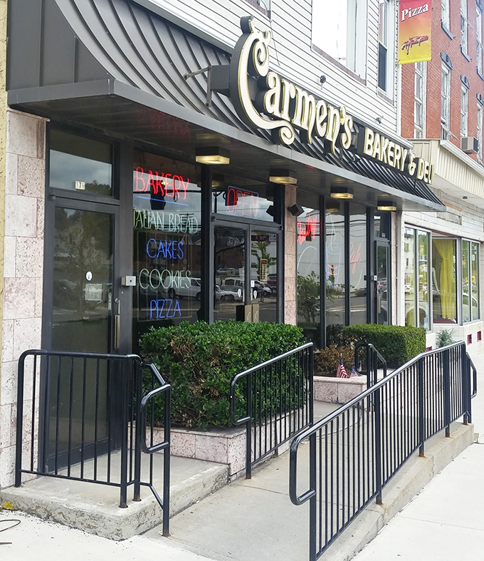 The entrance to epicurean enlightenment. Carmen's welcoming façade and colorful window signs invite hungry passersby to discover Pennsylvania's hoagie headquarters.