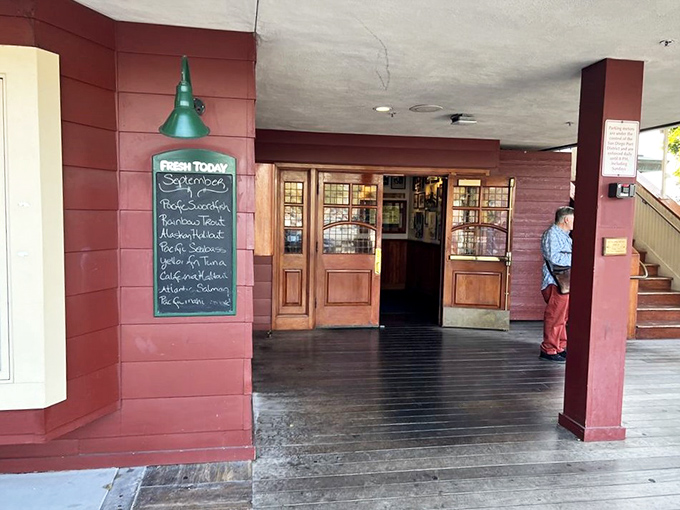 The entrance promises maritime treasures within. That chalkboard isn't just listing today's catches—it's advertising what was swimming this morning and will be dinner tonight.