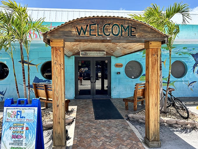 The wooden archway entrance doesn't just say "Welcome"—it practically sings it, flanked by palm trees and promising Florida Keys flavors just steps away.