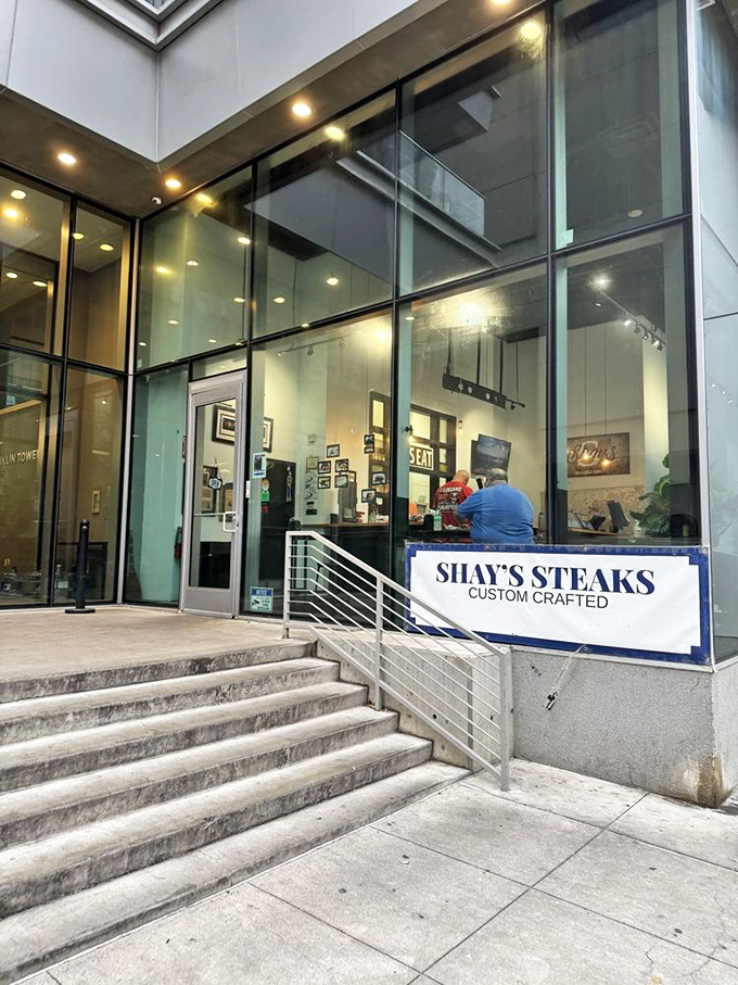 A few steps up to sandwich heaven—the entrance to Shay's Steaks promises an elevated experience in more ways than one.