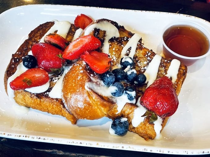 French toast that makes regular bread feel inadequate. Those berries aren't garnish—they're jewelry for a dish that deserves to be dressed up.