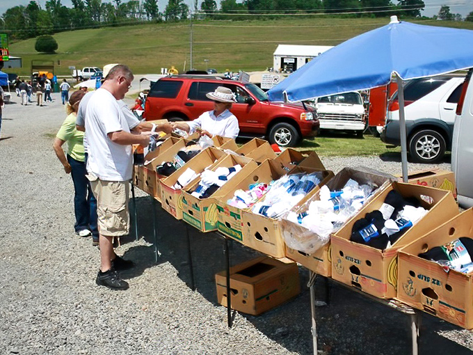 Bargain hunting at its finest! These boxes of everyday essentials remind us that flea markets aren't just about antiques—they're about stretching those dollars too.