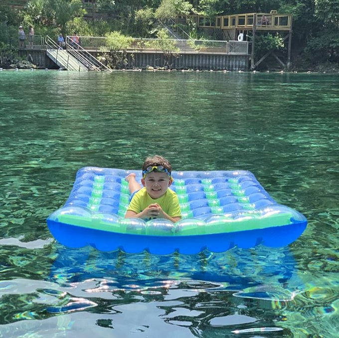 Childhood joy distilled to its purest form – floating in water so clear it seems like levitation rather than swimming.