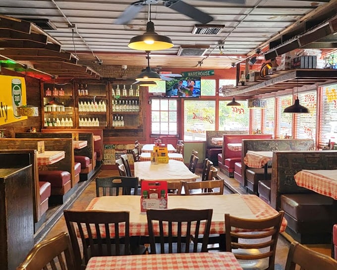 Red booths, wooden tables, and checkered tablecloths—the holy trinity of roadhouse dining, executed with the confidence of a place that knows its identity.