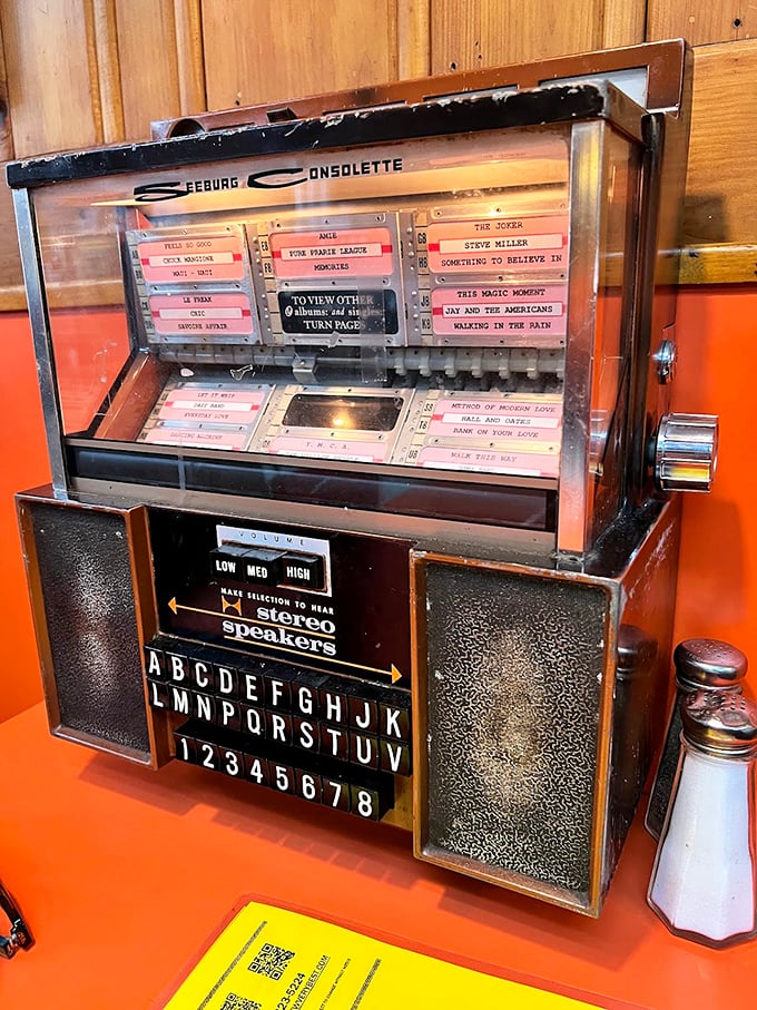 The jukebox doesn't stream—it delivers music with mechanical precision, each selection a deliberate choice rather than an algorithm's suggestion.
