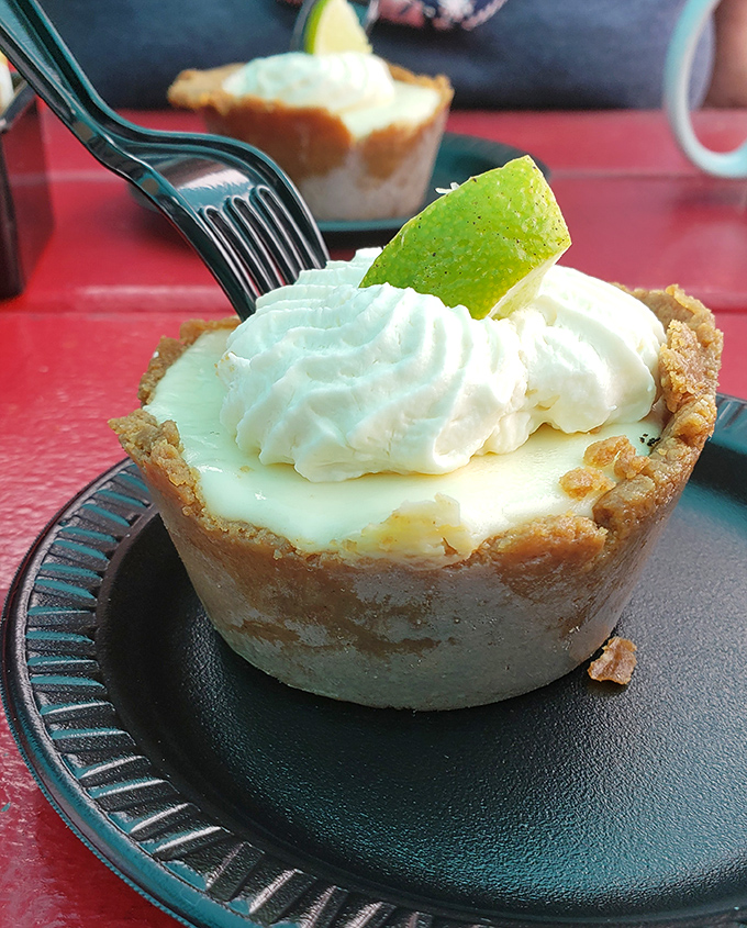 This key lime pie isn't messing around – the perfect balance of sweet and tart, topped with a dollop of whipped cream and a lime garnish for good measure.