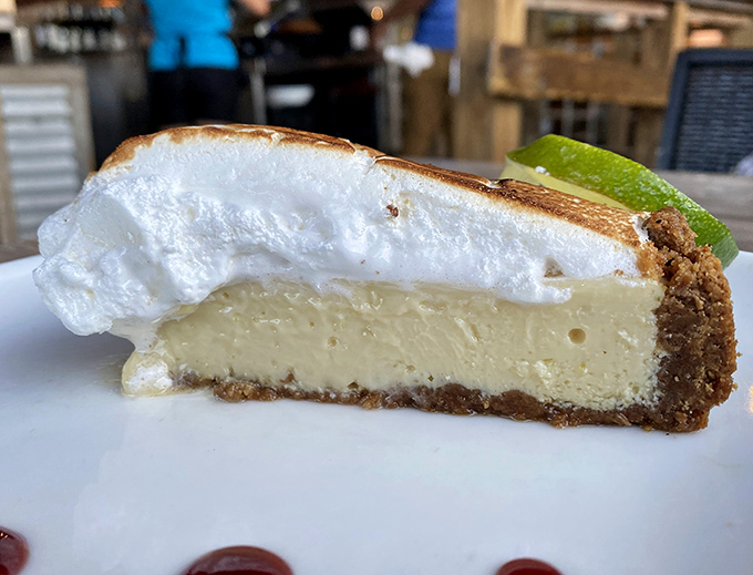 The legendary Key lime pie in all its glory—tangy, sweet, and topped with a cloud of meringue that makes you wonder why you'd ever order anything else.